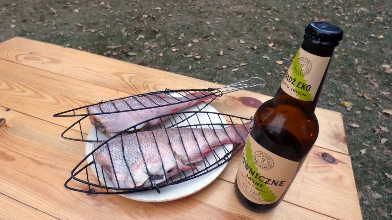 Delicious grilled fish called rose fish and "Piwniczne Jasne" beer